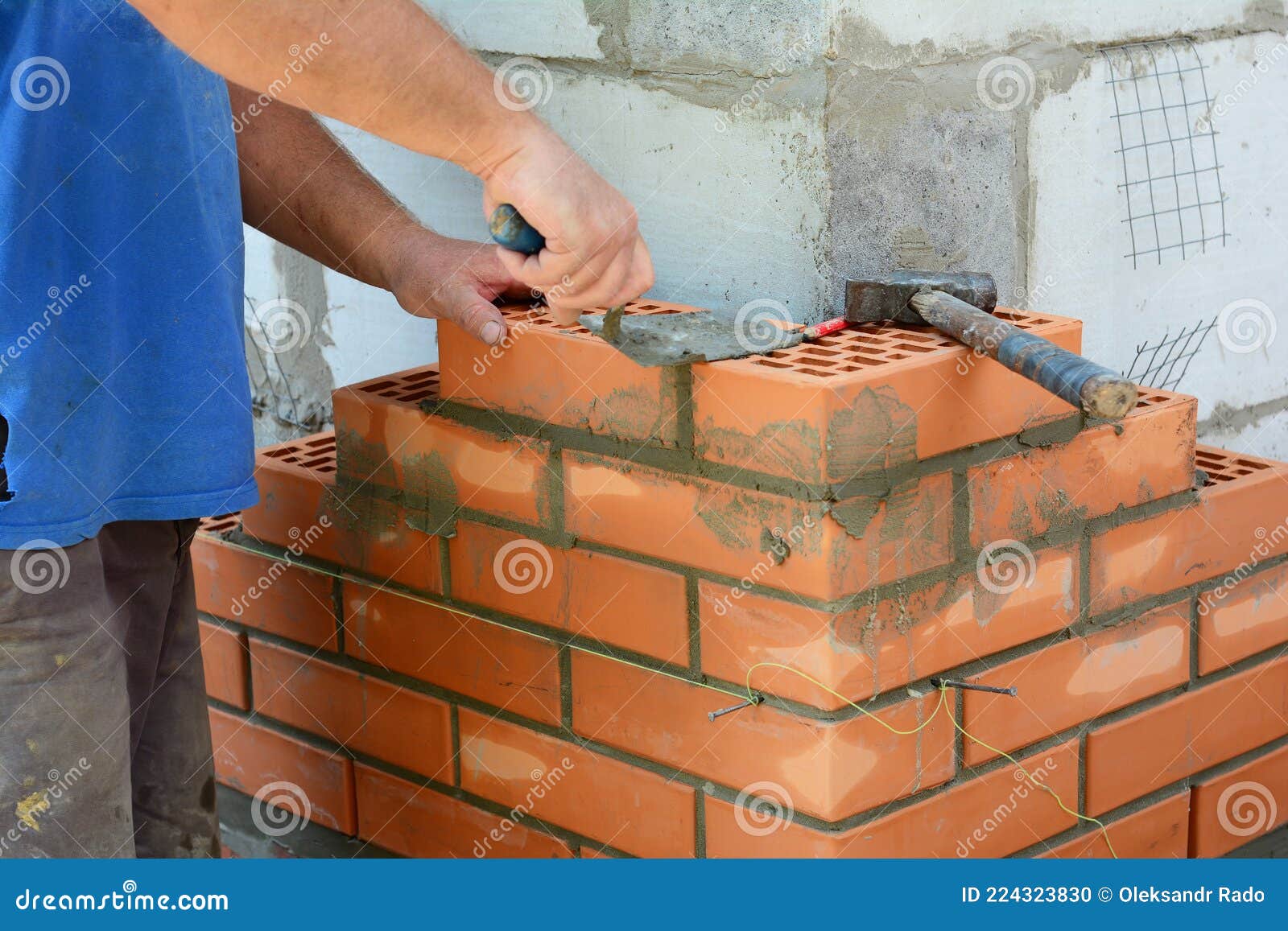 Masonry Brickwork. a Masonry Contractor is Laying the House Corner with ...