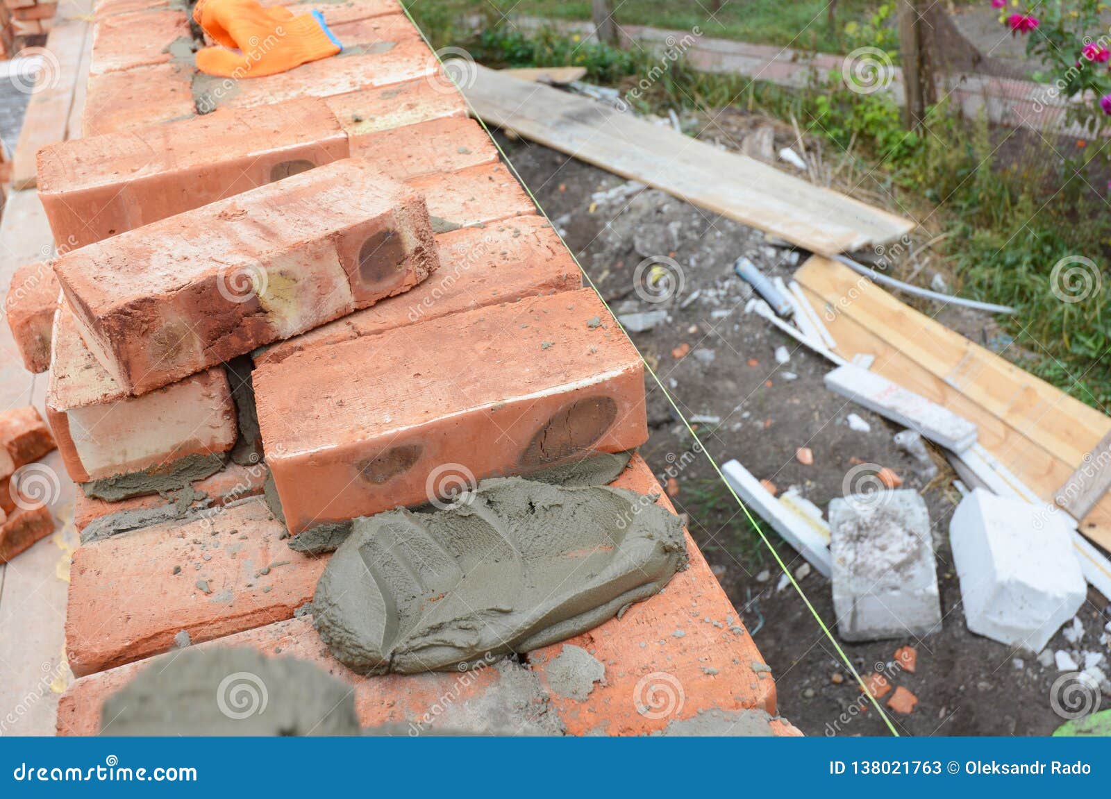 Masonry. Laying Brick Wall on House Construction Site with Concrete ...