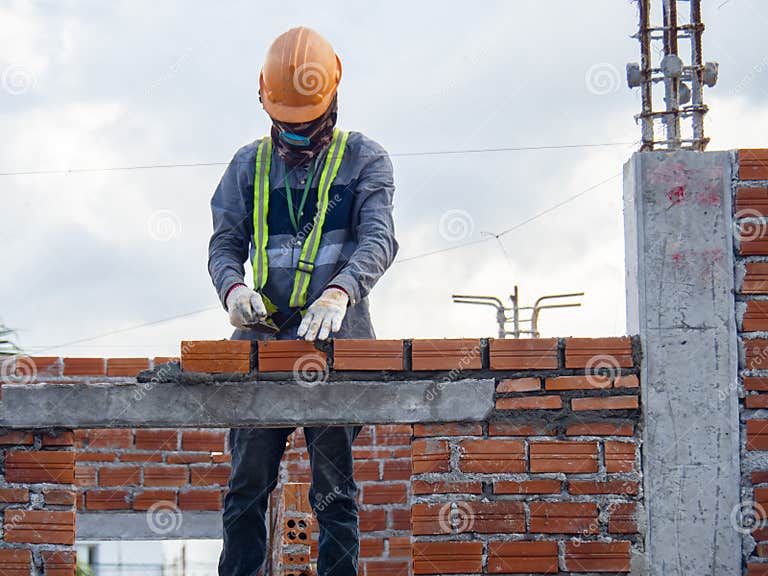Masonry Work, Worker Laying Brick of an Office Building. Architectural ...