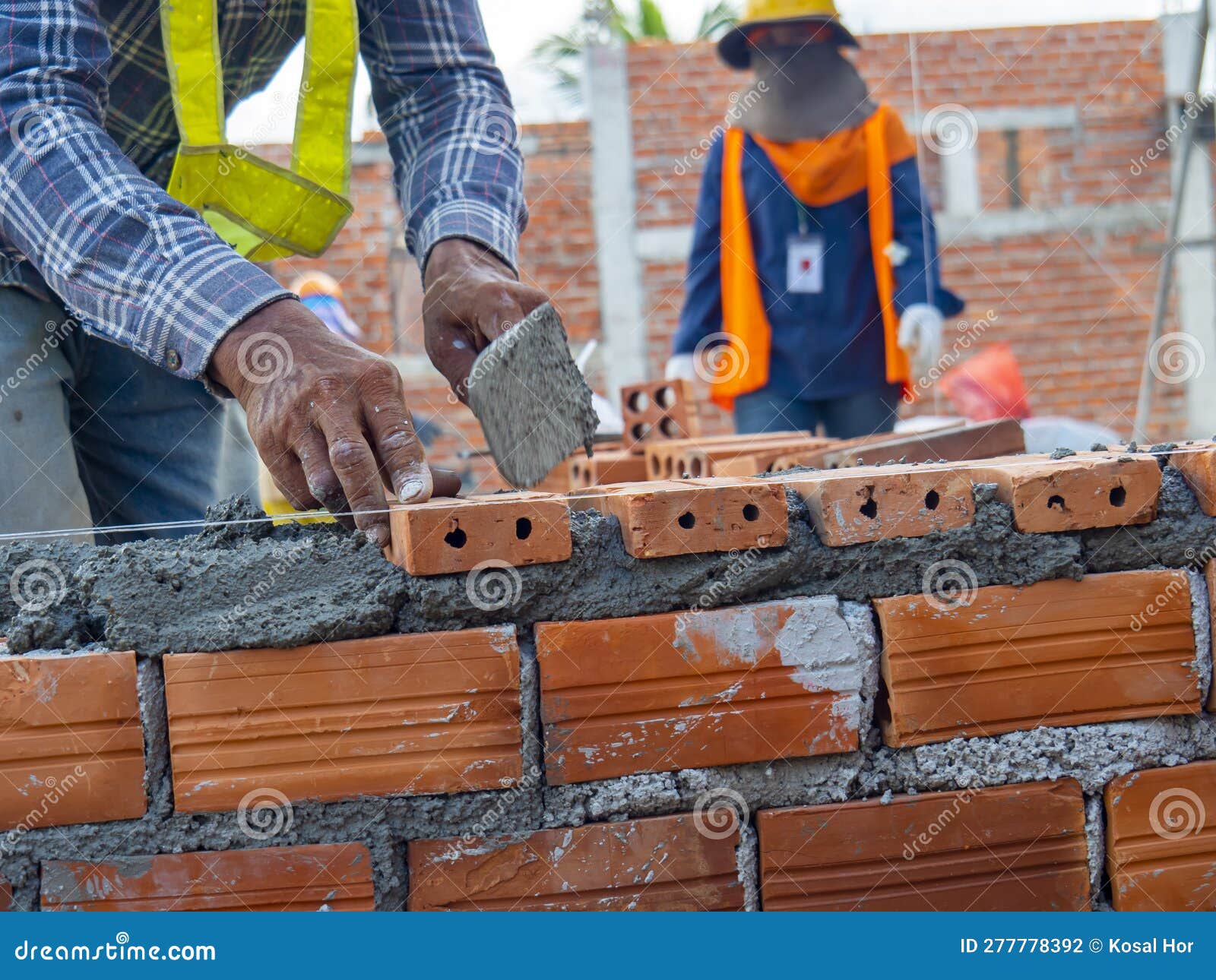 Closeup of Worker Laying Brick at Construction Site. Masonary Work ...