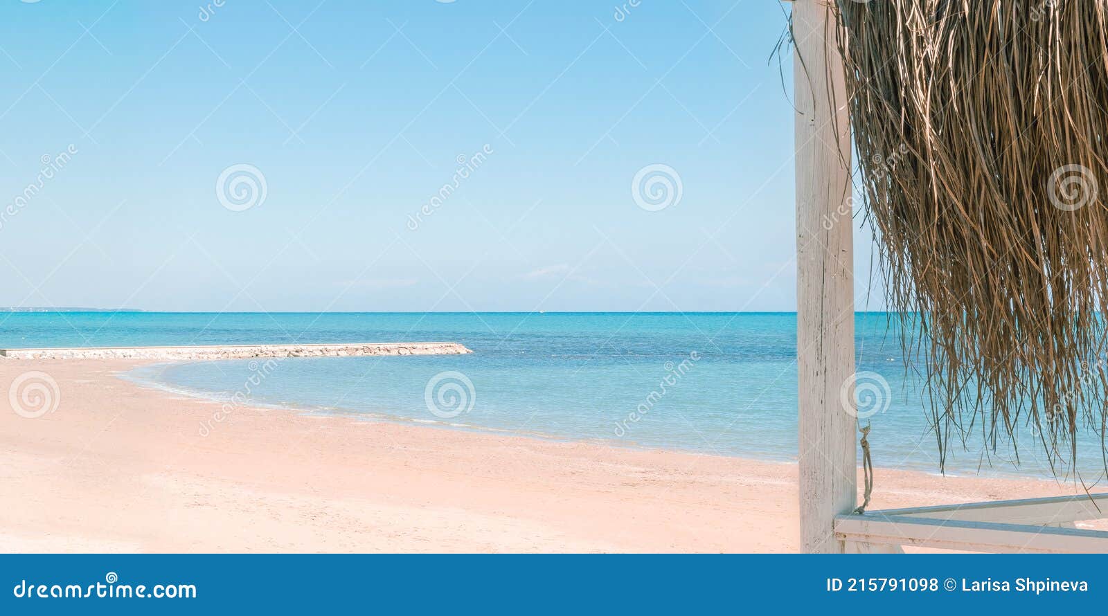 Massage Huts With Thatched Roof On Sand Beach Along Seaside Luxury