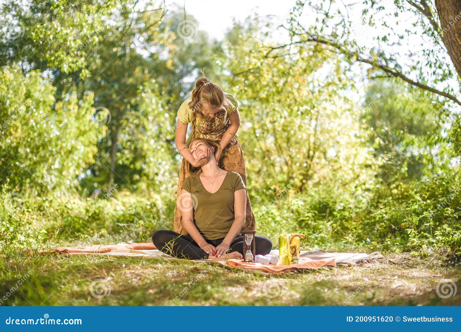 Masseuse Giving a Massage on the Grass. Stock Photo - Image of msseur ...
