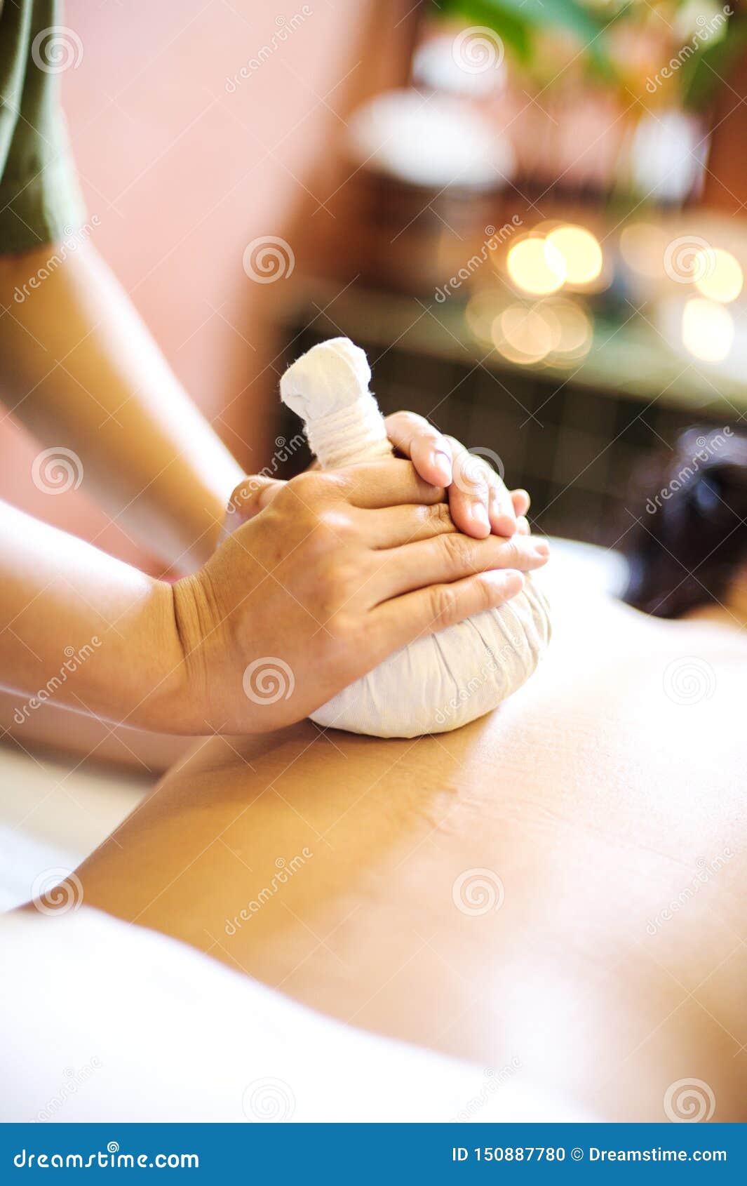 A Massage Therapist Giving a Back Massage Stock Photo - Image of hand ...