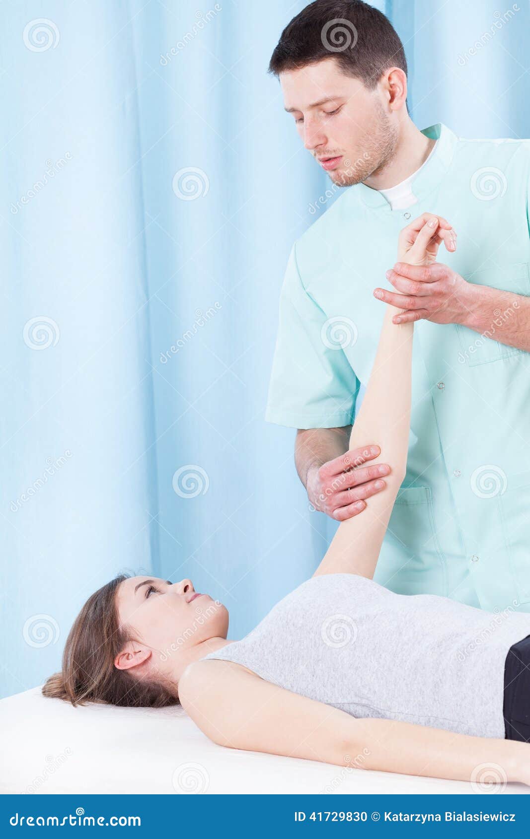 Massaging broken arm stock photo. Image of physiotherapist - 41729830