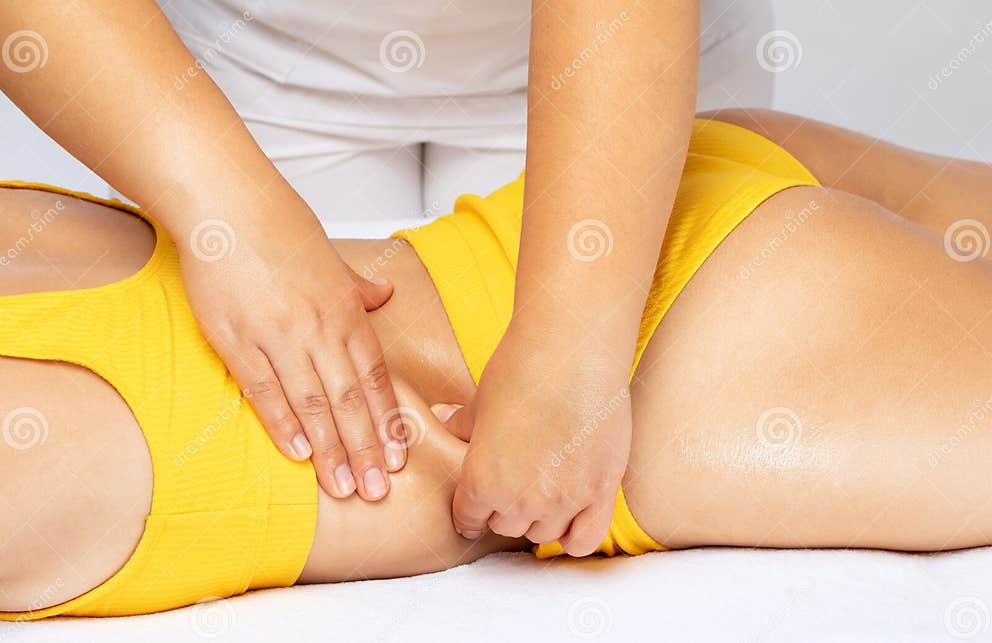 The Masseur Makes A Massage On The Abdomen Waist And Hips In The Spa Overweight Treatment