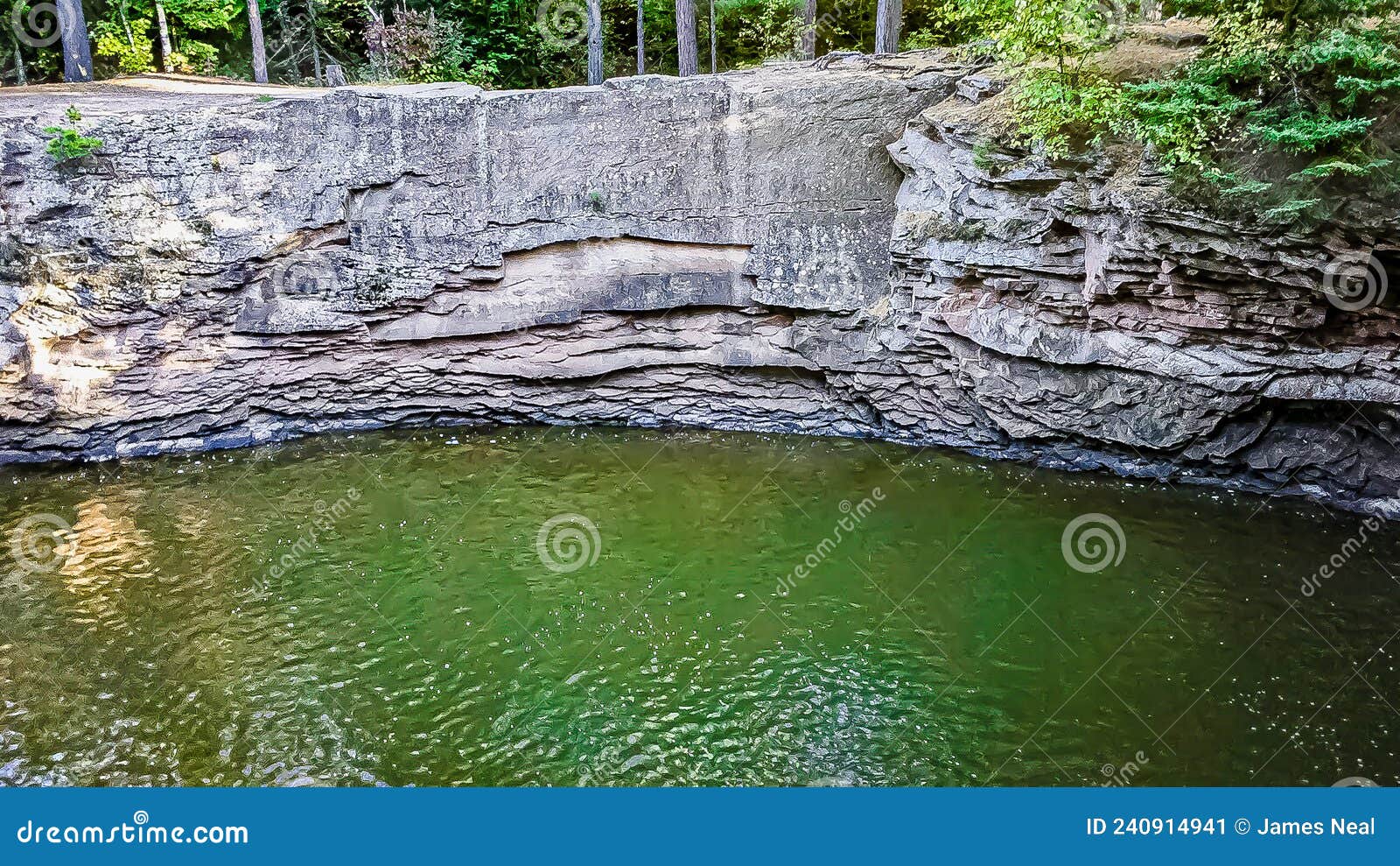 A Massive Cliff into a Natural Pool Below Stock Image - Image of ...