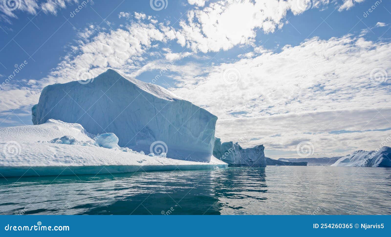 Massive Icebergs and Dramatic Sky in Disko Bay in Greenland Stock Image ...