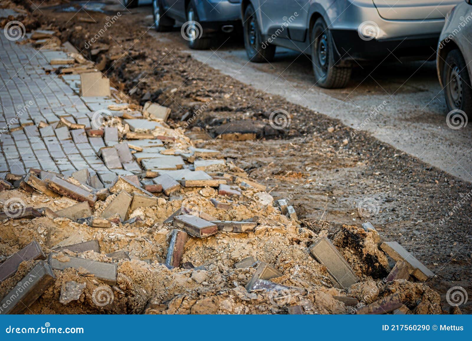 Massive Pavement Damage with Cracks at Street and Row of Cars Stock ...