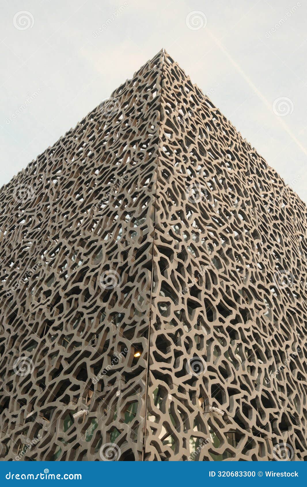 A Large Triangular Building With Geometric Architecture On The Side Of It Editorial Image