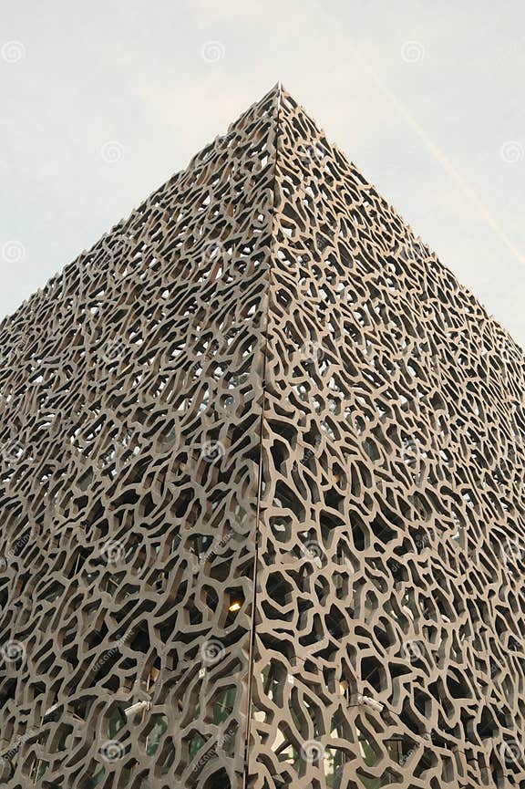 A Large Triangular Building with Geometric Architecture on the Side of ...