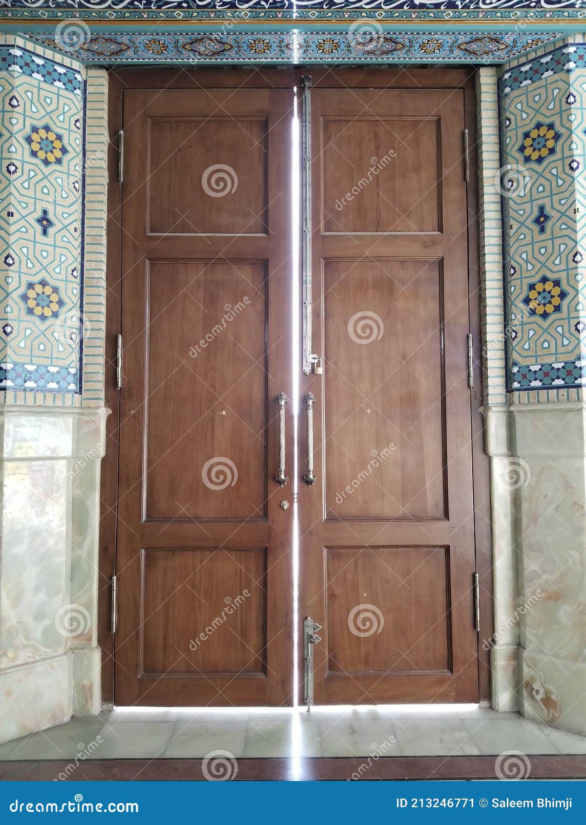 Massive Wooden Doors with Arabesque Tile Work Stock Image - Image of ...