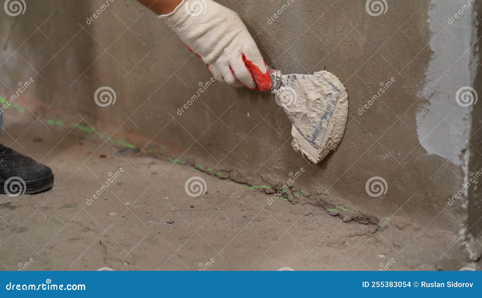 The Master on a Metal Spatula Applies the Solution To the Wall for ...