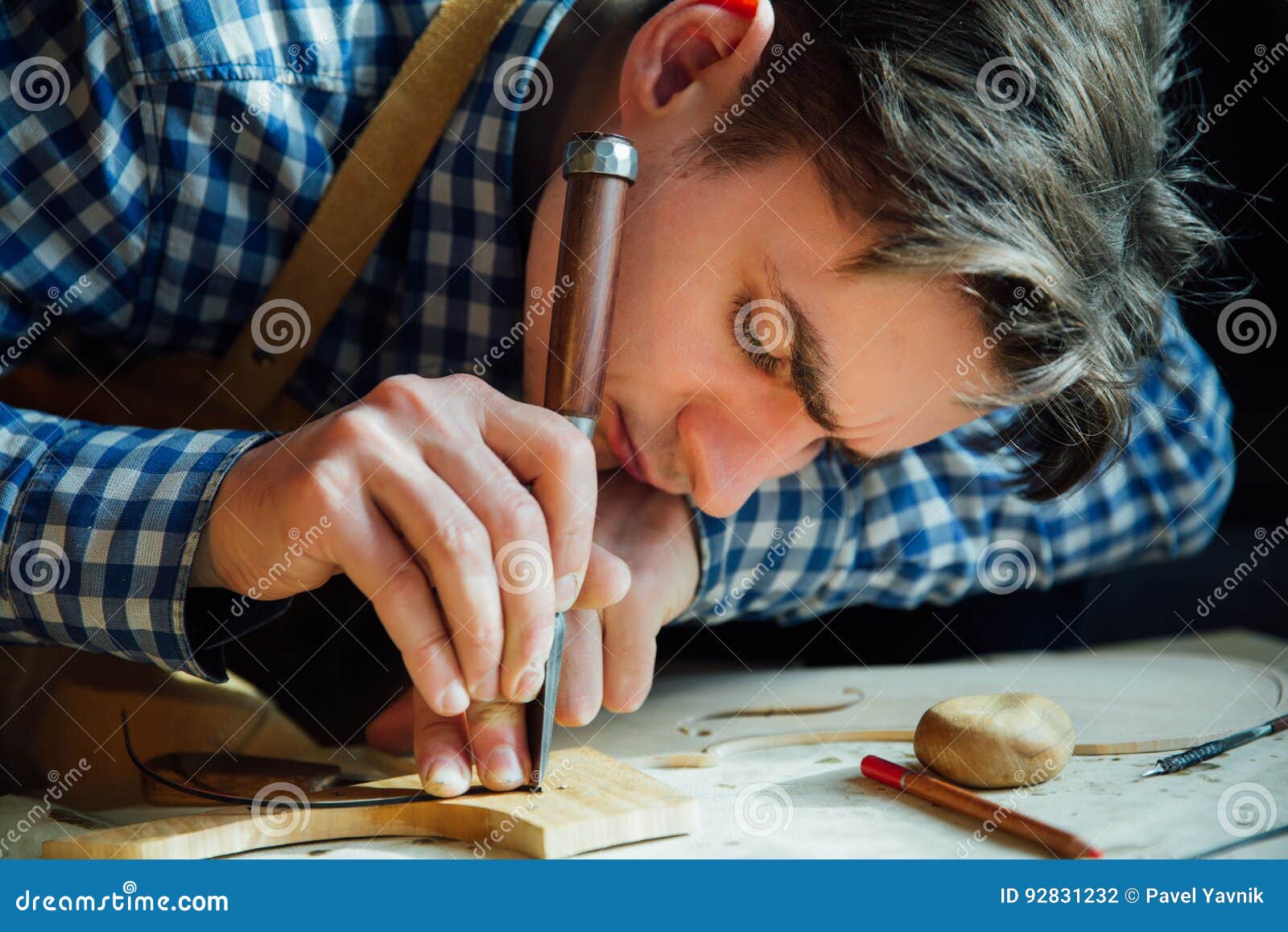 Master Artisan Luthier Working on the Creation of a Violin. Painstaking ...