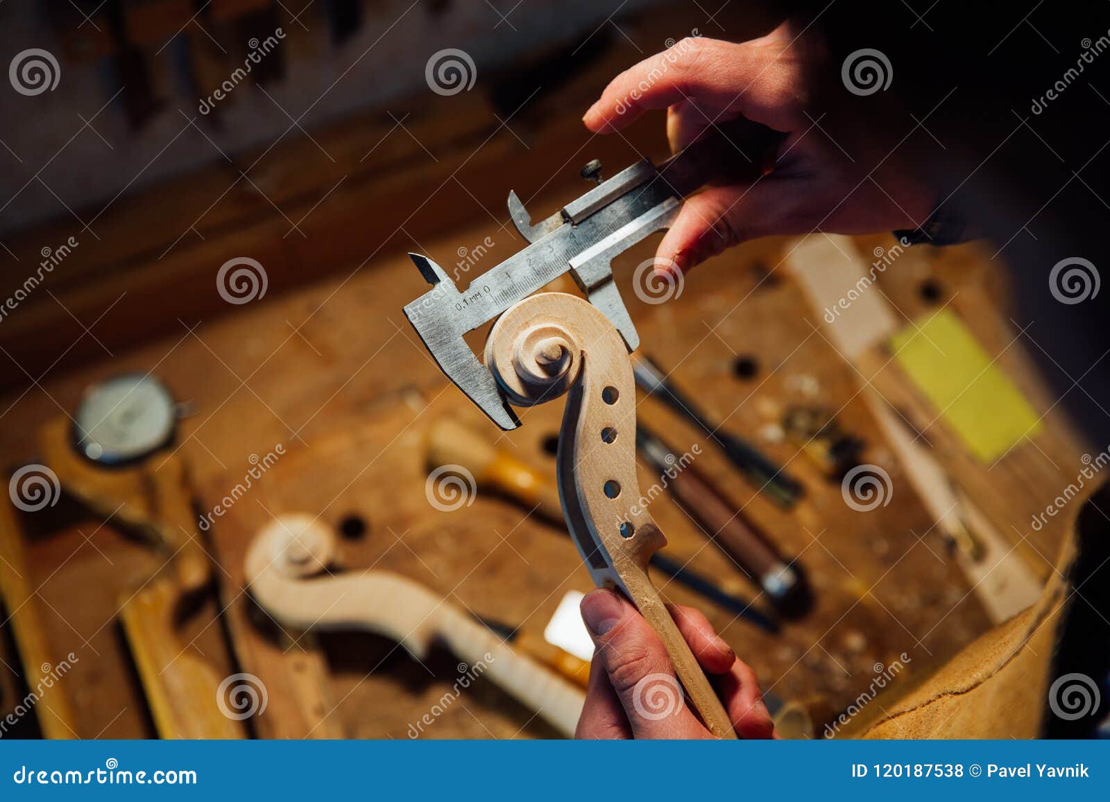 Master Artisan Luthier Working on Creation of a Violin Scroll. Detailed ...