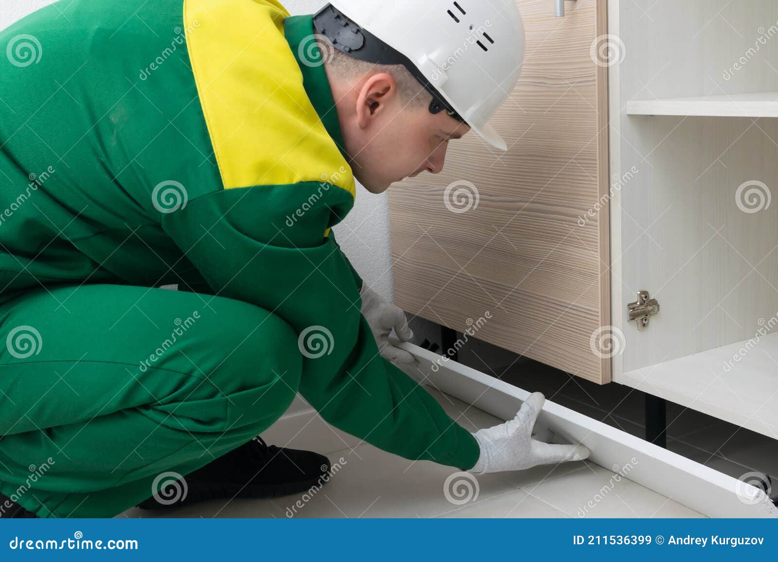The Master of the Assembly, Installs the Lower Element of the Kitchen ...