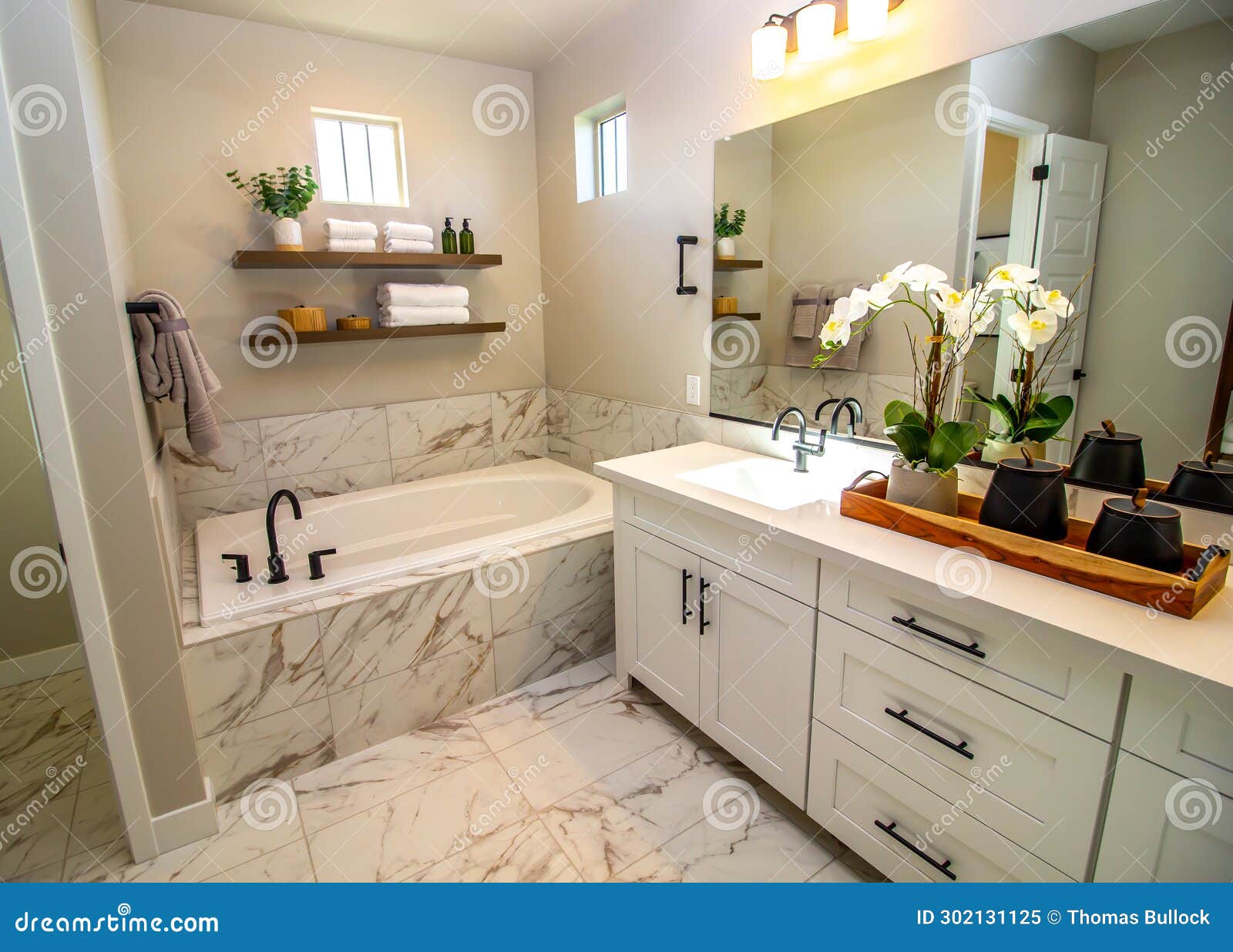 Master Bathroom with Vanity and Raised Tub Stock Image - Image of ...