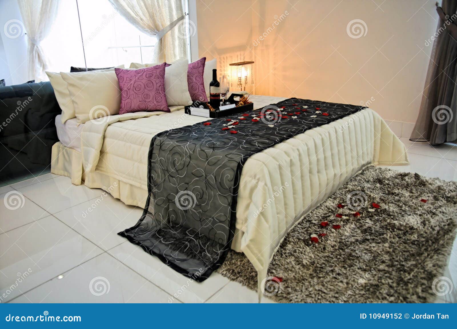 Master Bedroom in a Private Condominium Stock Photo - Image of petal ...