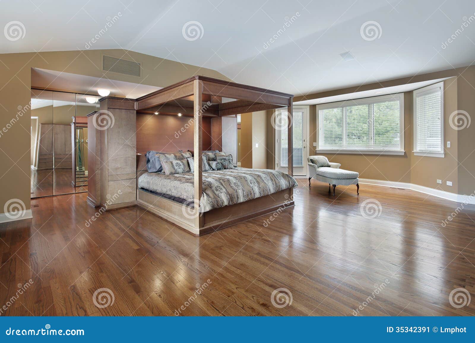 Master Bedroom with Wood Framed Bed Stock Image - Image of luxury ...
