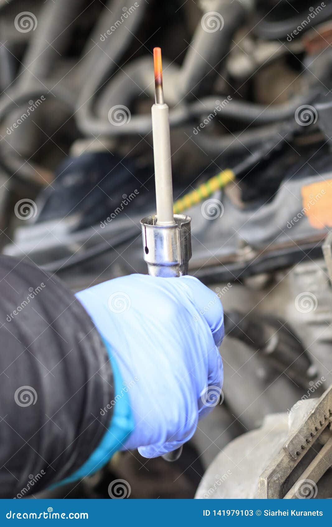 Master in Blue Gloves Check the Candle. Engine Compartment in the Car ...