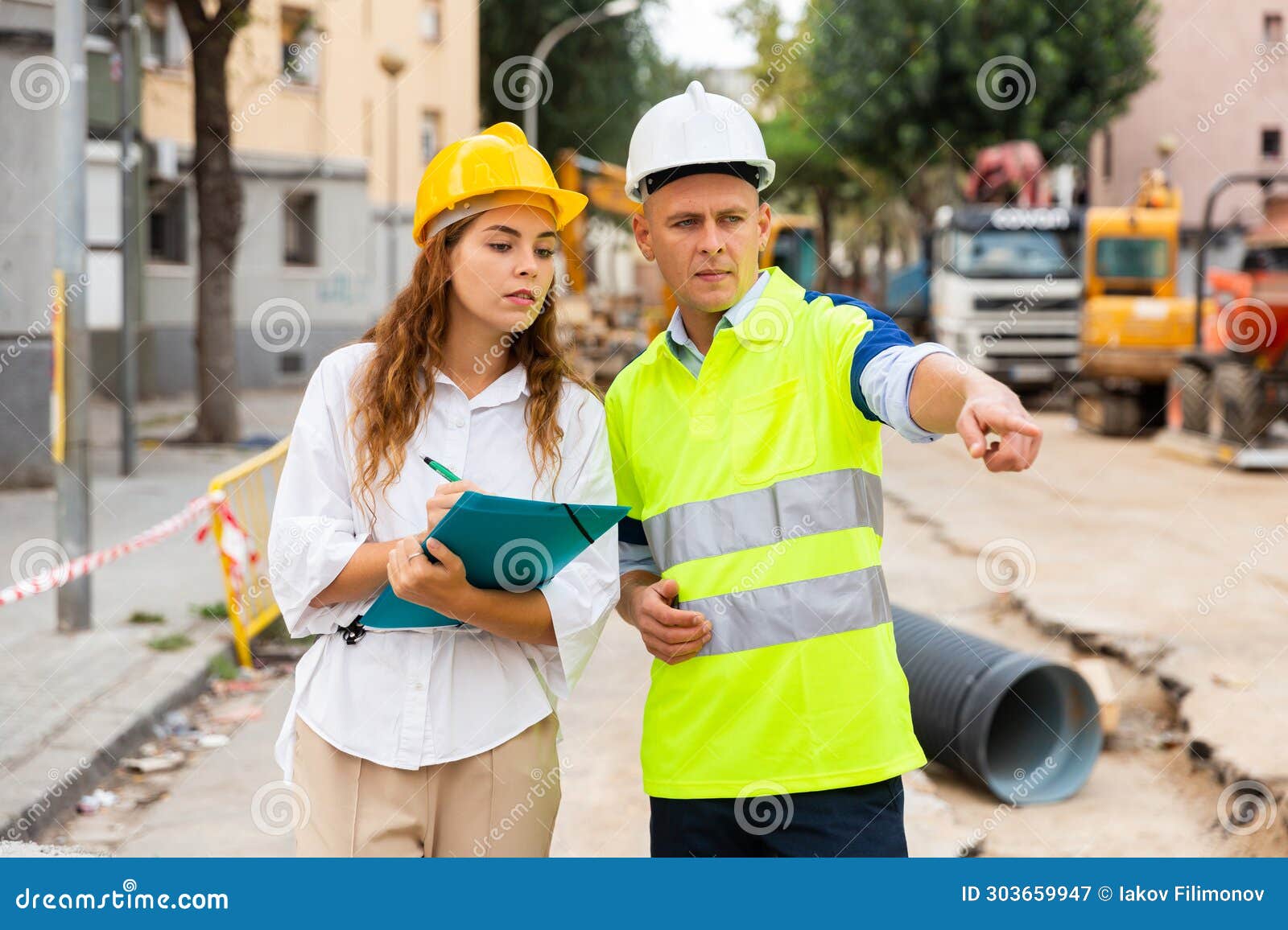 Master Builder and Architect Talking in Construction Area Stock Image ...