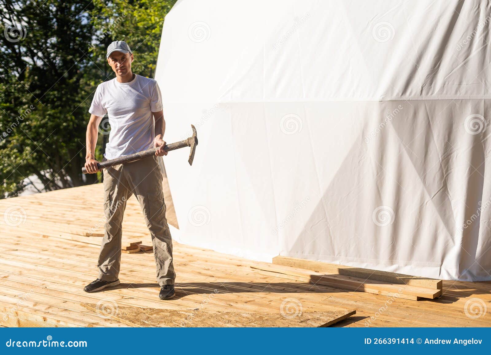 The Master Builds the Dome. Outside Spherical Glamping Dome ...