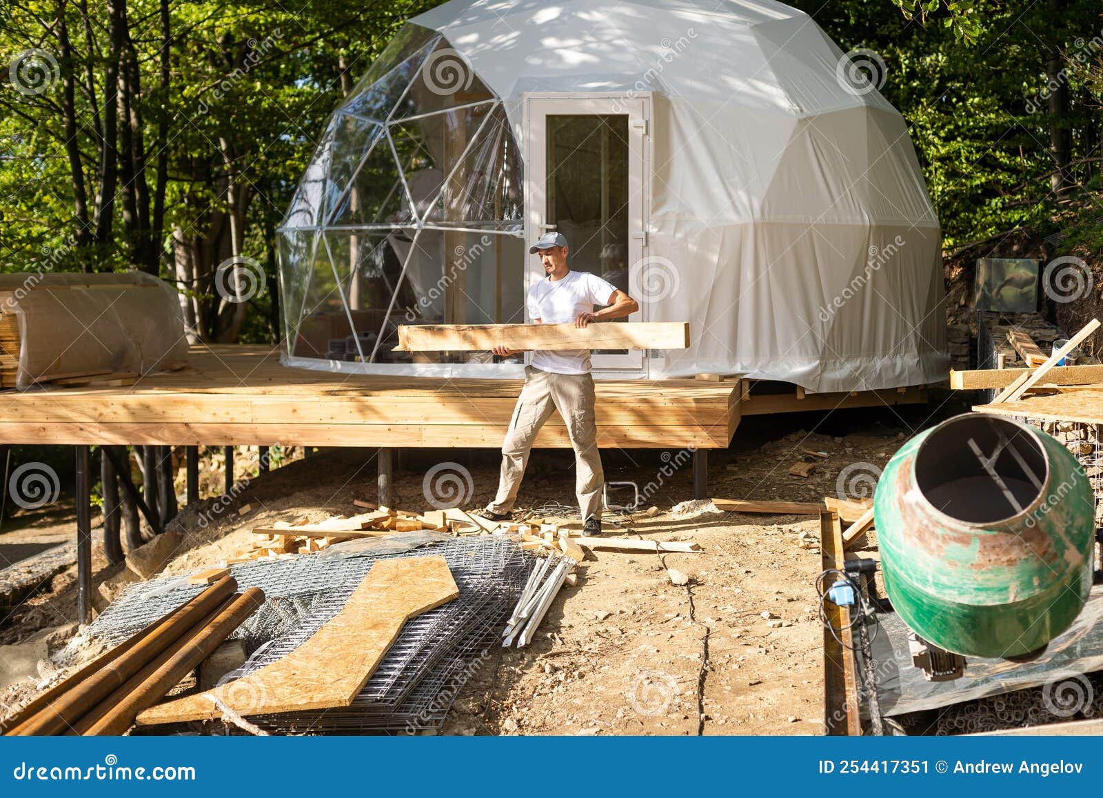 The Master Builds the Dome. Outside Spherical Glamping Dome. Hemispherical Structure Lattice ...