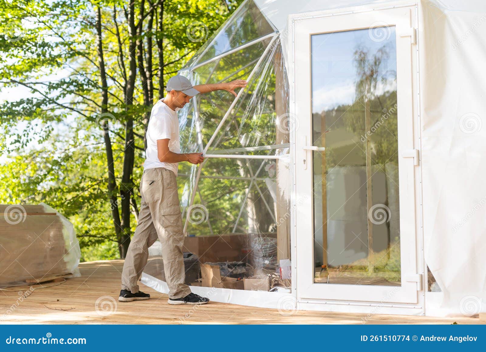 The Master Builds the Dome. Outside Spherical Glamping Dome ...