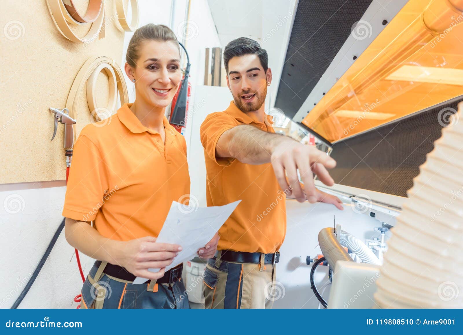 Master Carpenter Explaining Maintenance of Machine Stock Photo - Image ...