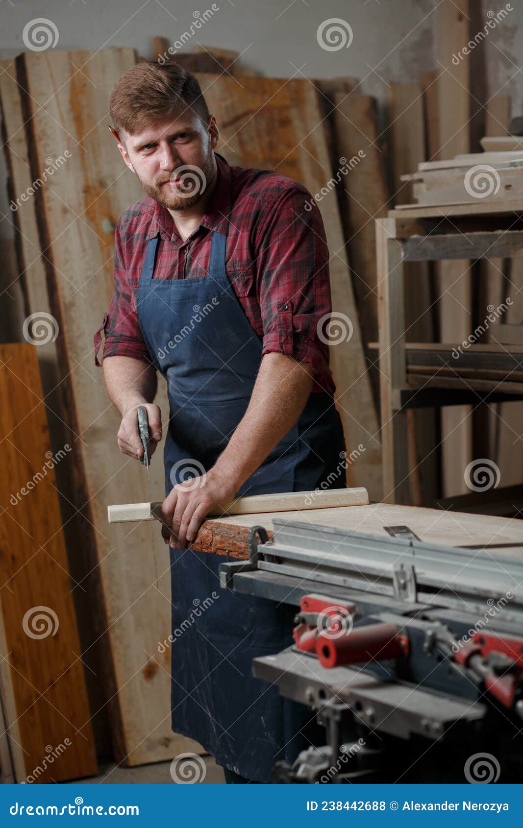 Master Carpenter Saws Board with Hacksaw in Workshop Stock Photo ...