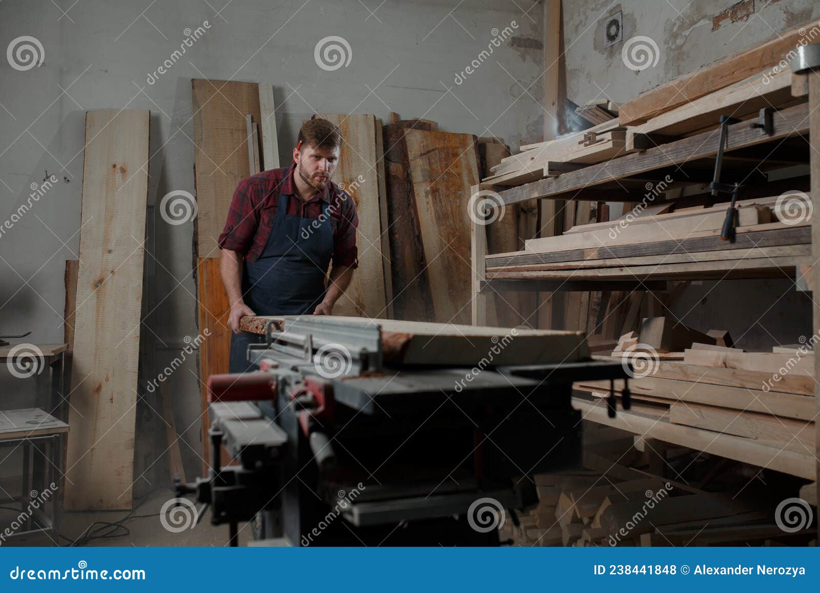 Master Carpenter Saws the Board on Machine in Workshop Stock Photo ...