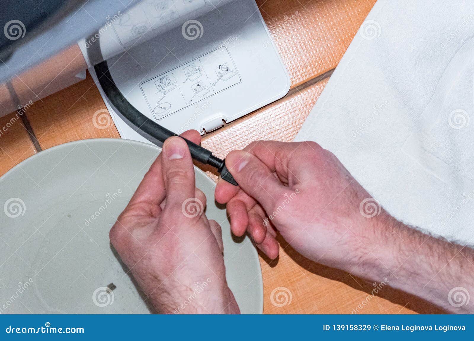 The Master Carries Out the Maintenance of the Washing Machine, Cleaning ...