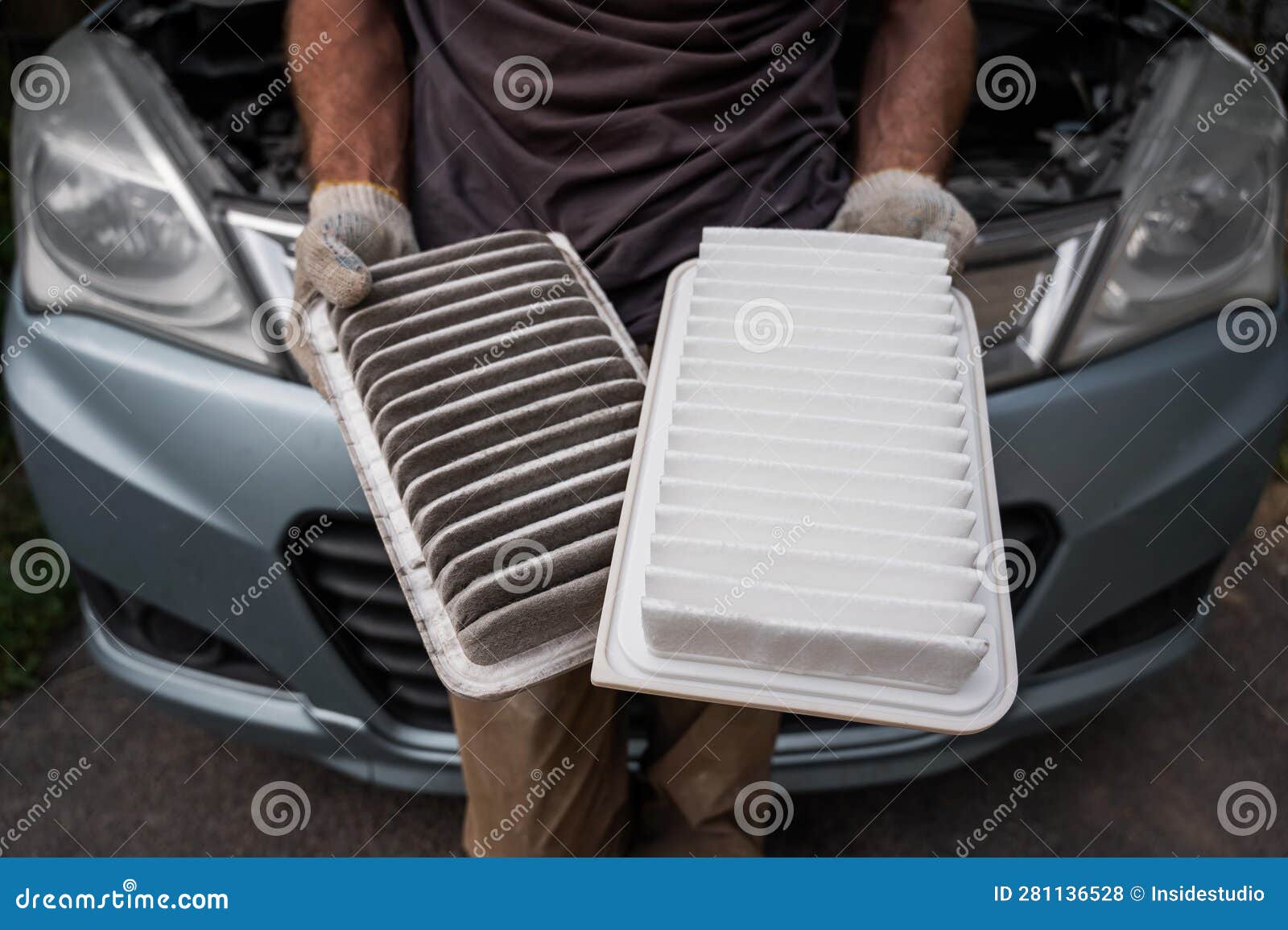 The Master Changes the Air Filter in the Car Engine. Stock Photo ...