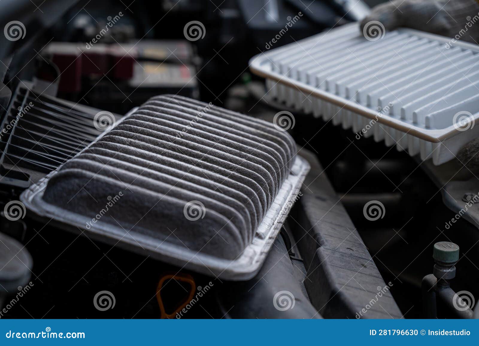 The Master Changes the Air Filter in the Car Engine. Stock Photo ...