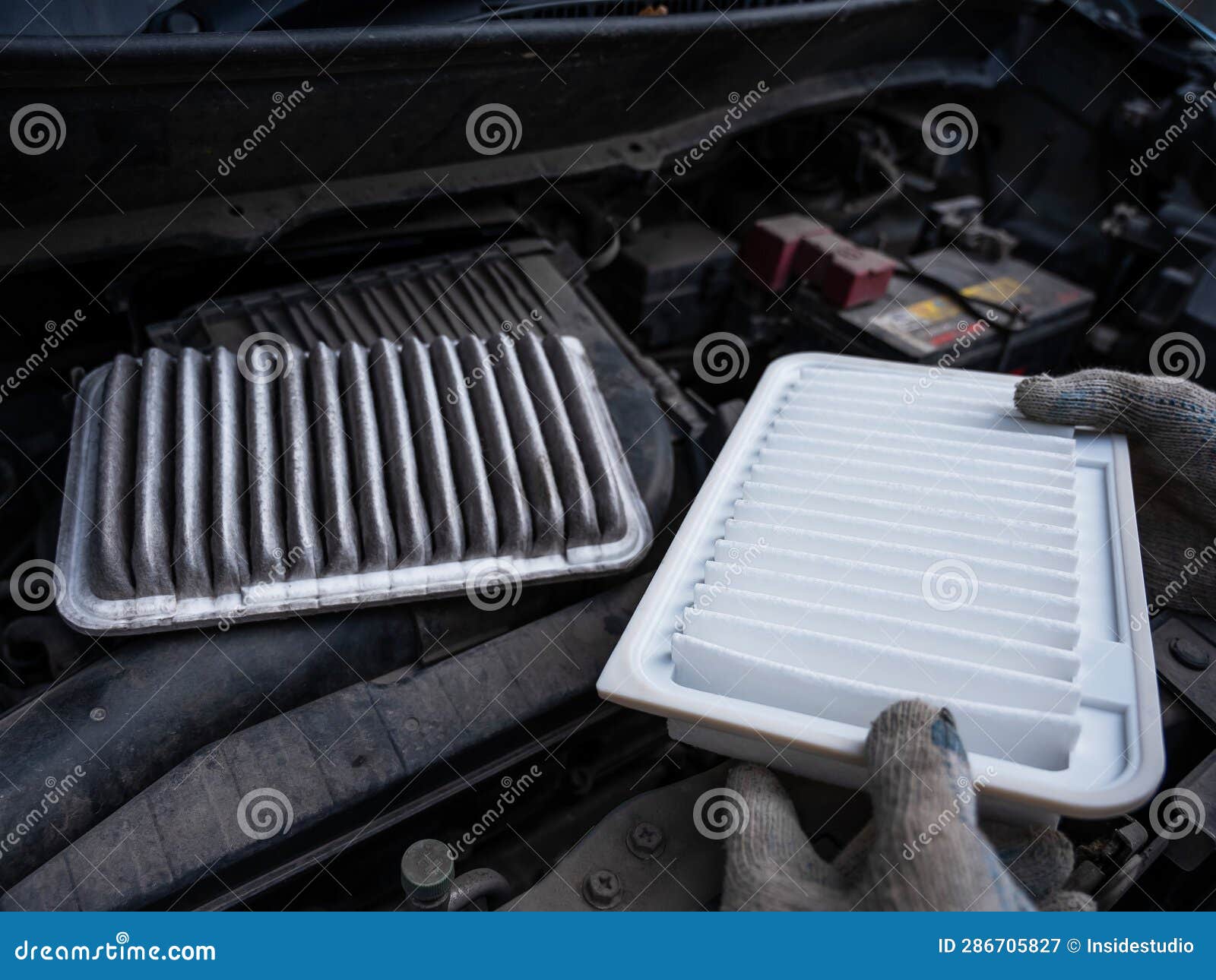 The Master Changes the Air Filter in the Car Engine. Stock Image ...