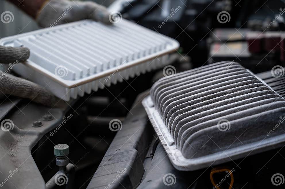 The Master Changes the Air Filter in the Car Engine. Stock Photo ...