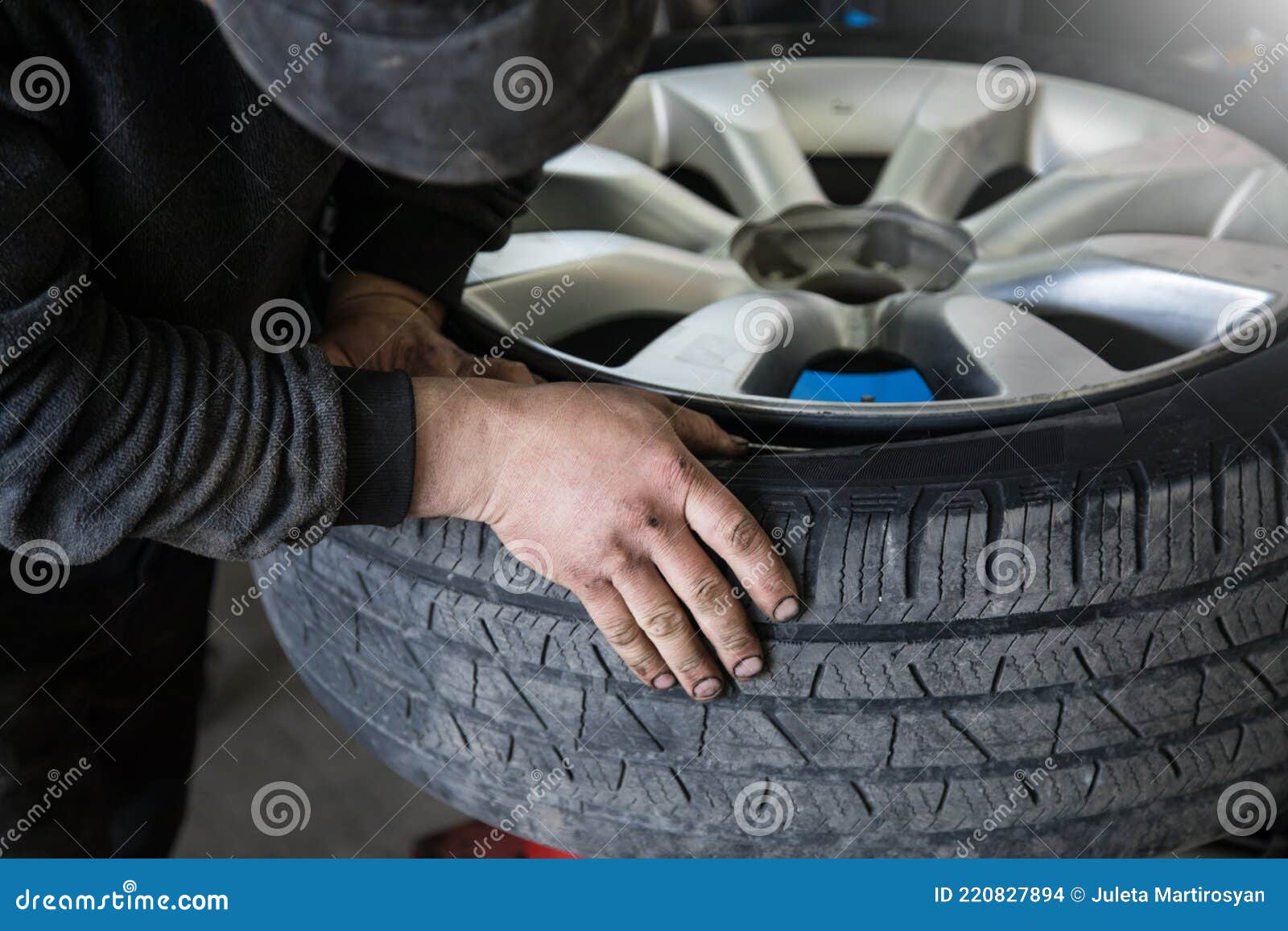 The Master Changes the Wheel Stock Photo - Image of adult, wheel: 220827894