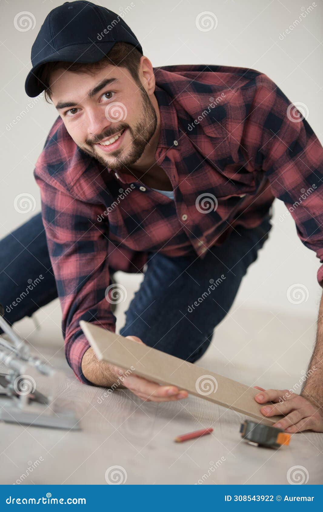 Checking The Tiles In The Bathroom. Quality Control When Laying Ceramic ...