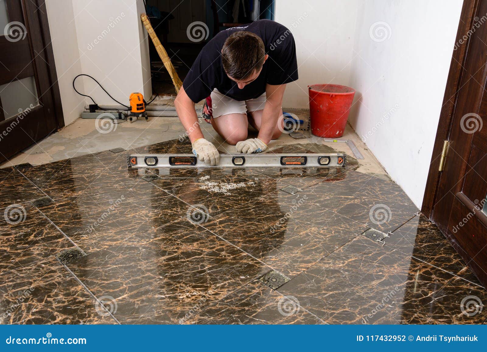 The Master Checks the Tile Surface`s Tile Level Stock Photo - Image of ...