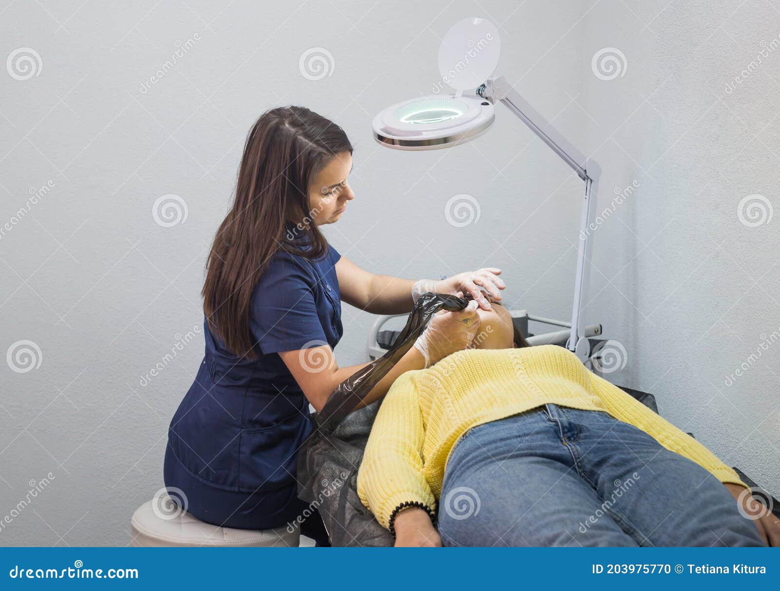 Master and Client in the Salon during the Permanent Eyebrow Makeup ...