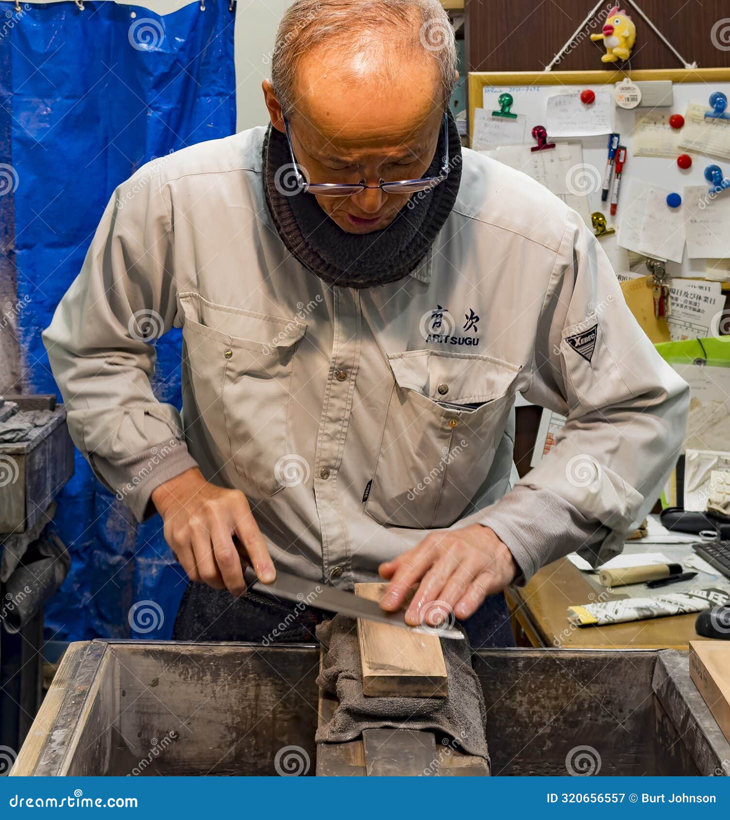 Master Craftsman Sharpening Knife in Workshop Editorial Photography ...