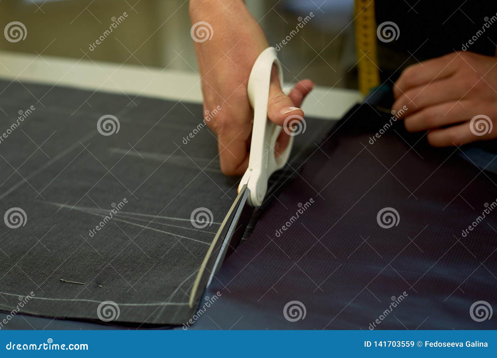 Master Cuts Fabric. Nesting. Suiting Fabric Marked with White Chalk ...