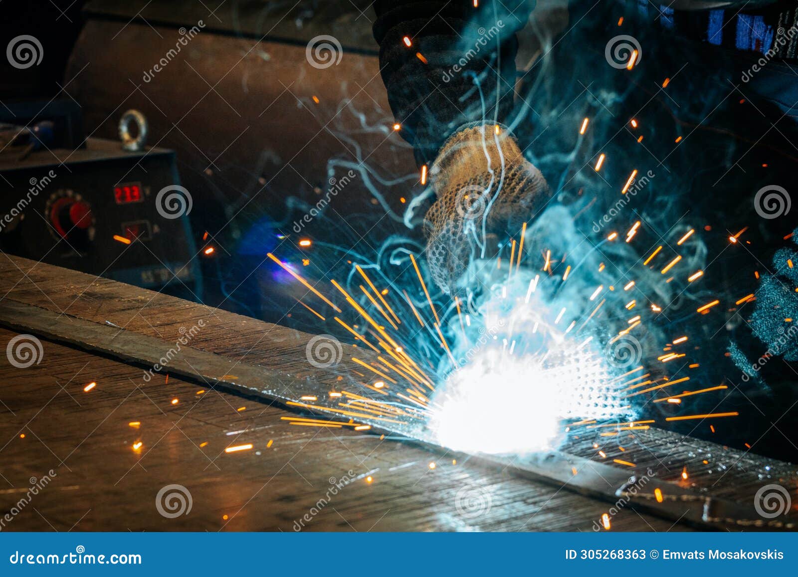 Master is Doing Welding at His Workplace in the Workshop, while Sparks ...