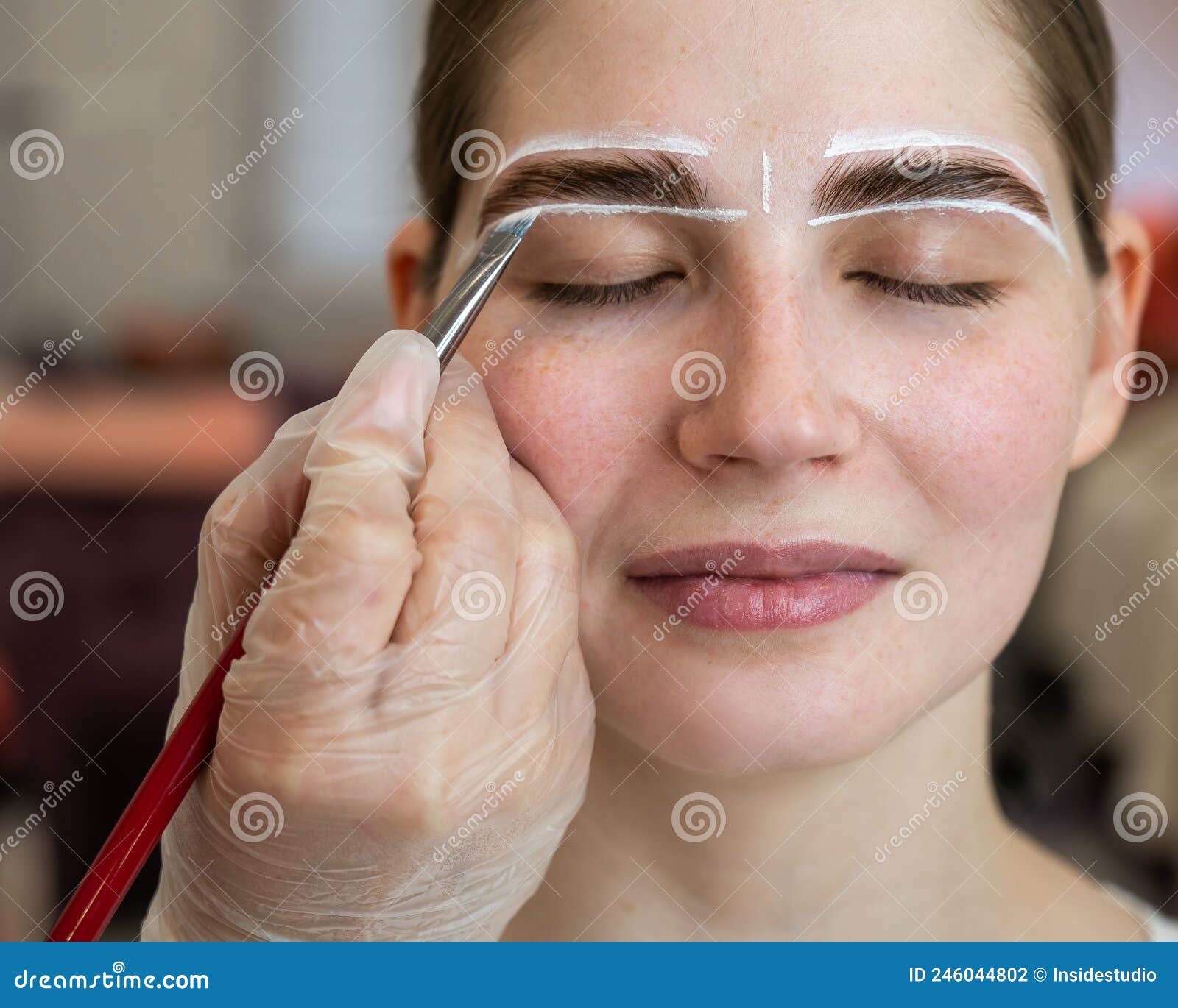 The Master Draws the Shape of the Eyebrows with White Paint before ...