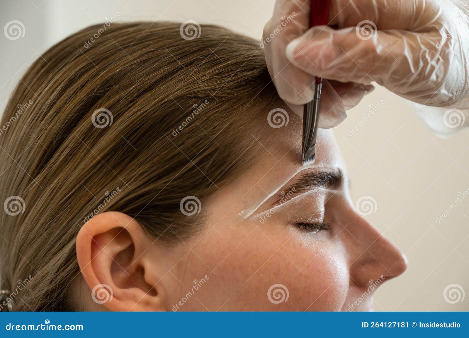 The Master Draws the Shape of the Eyebrows with White Paint before ...