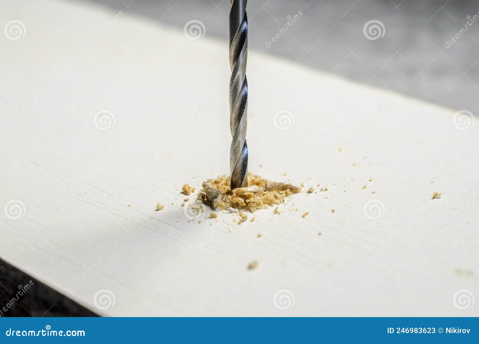 Master Drills A Hole In The Board Drill. Being Driven Into Wood ...