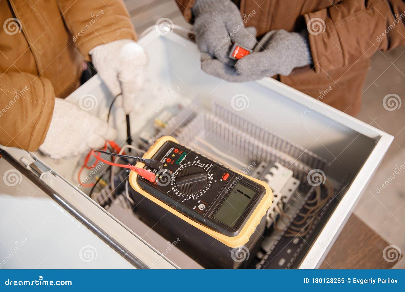 Master Electrician Checks Electrical Panel with Multimeter for Short ...