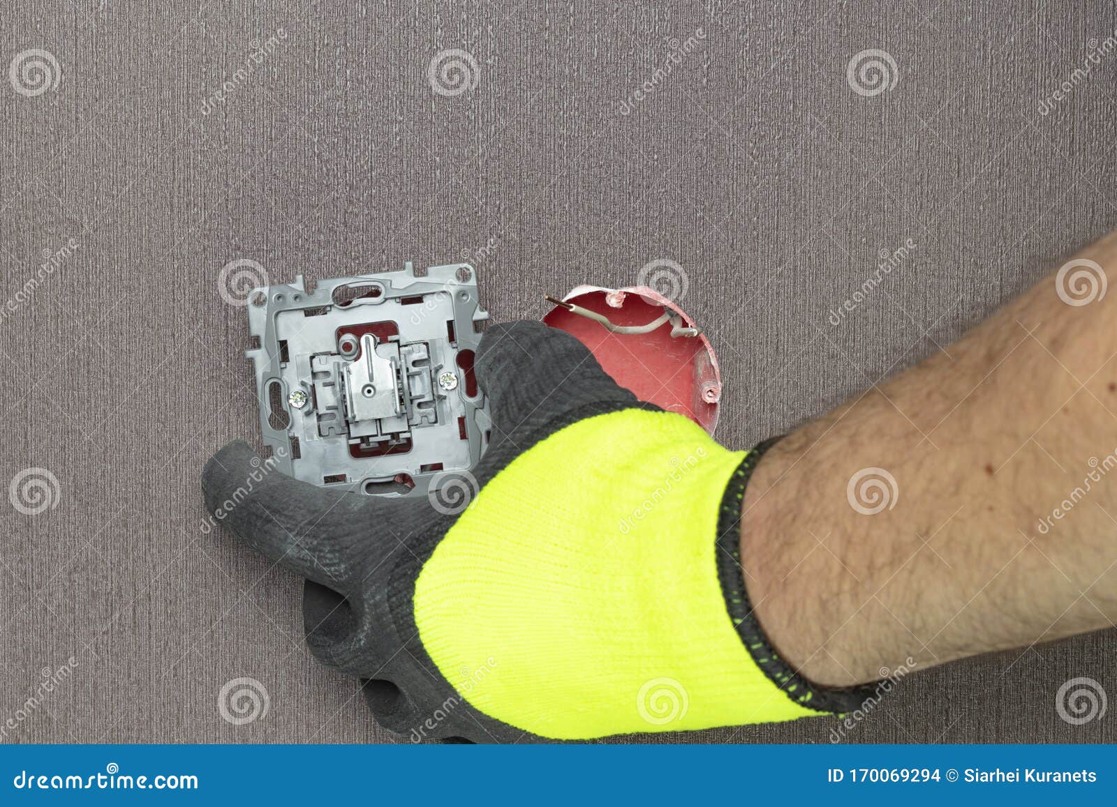 The Master Electrician Sets the Switch. Close-up. the Room is Colored ...