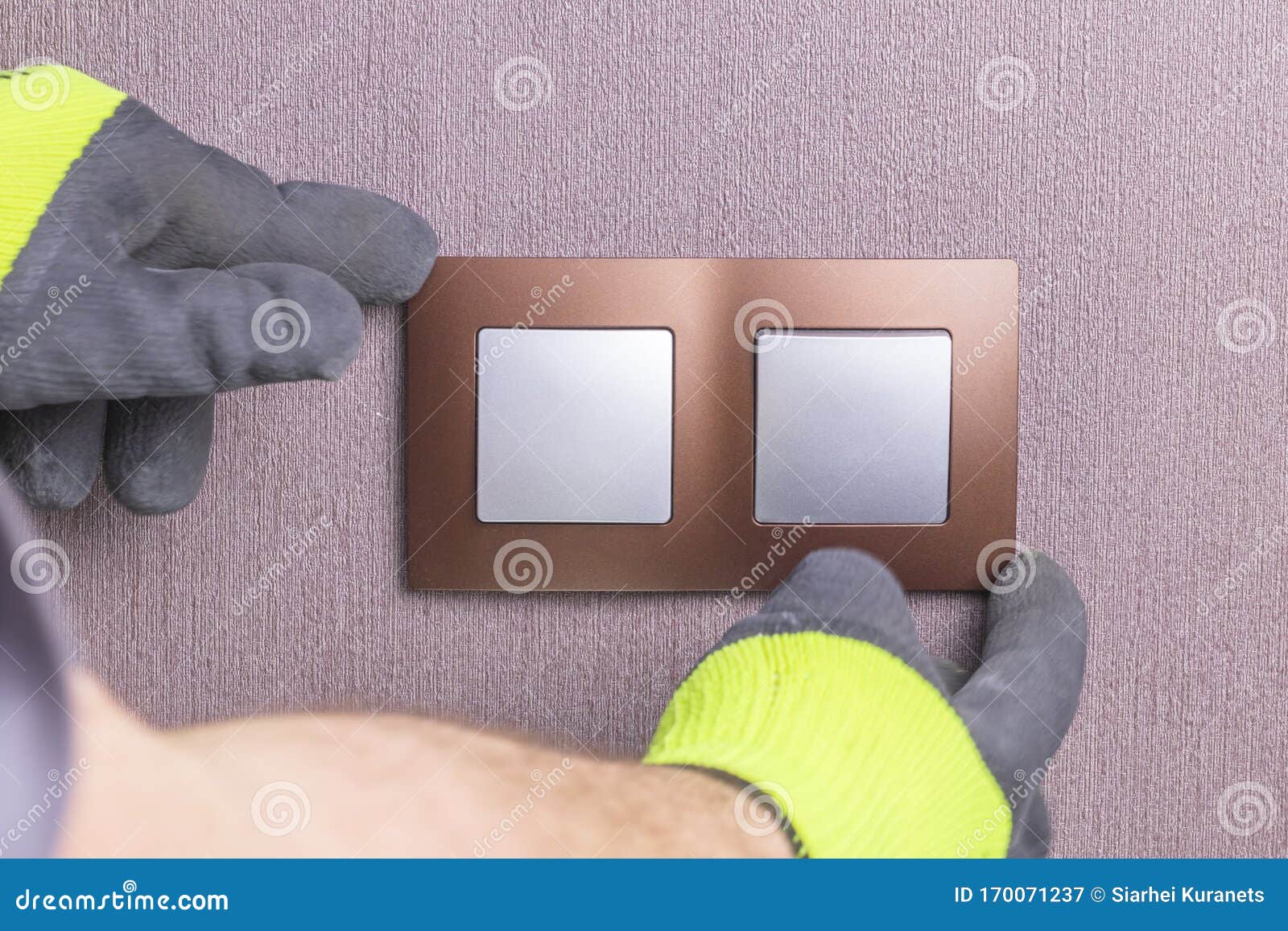 The Master Electrician Sets the Switch. Close-up. the Room is Colored ...