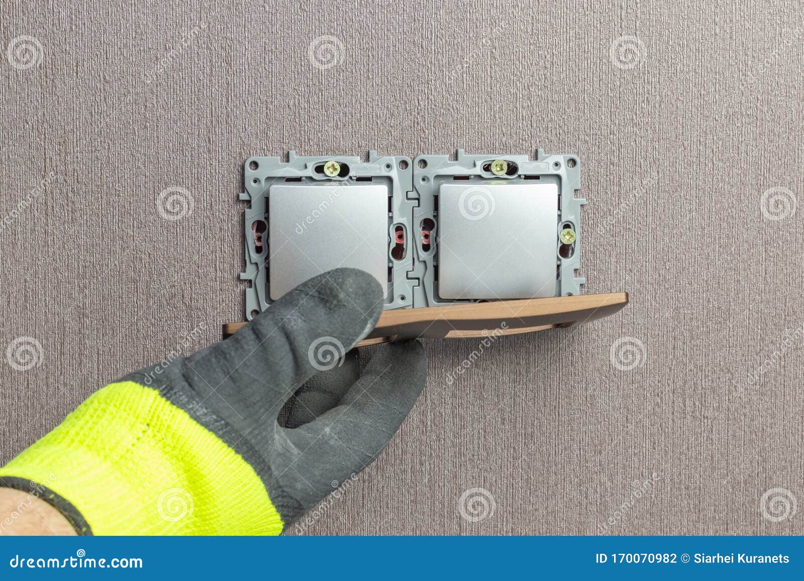 The Master Electrician Sets the Switch. Close-up. the Room is Colored ...