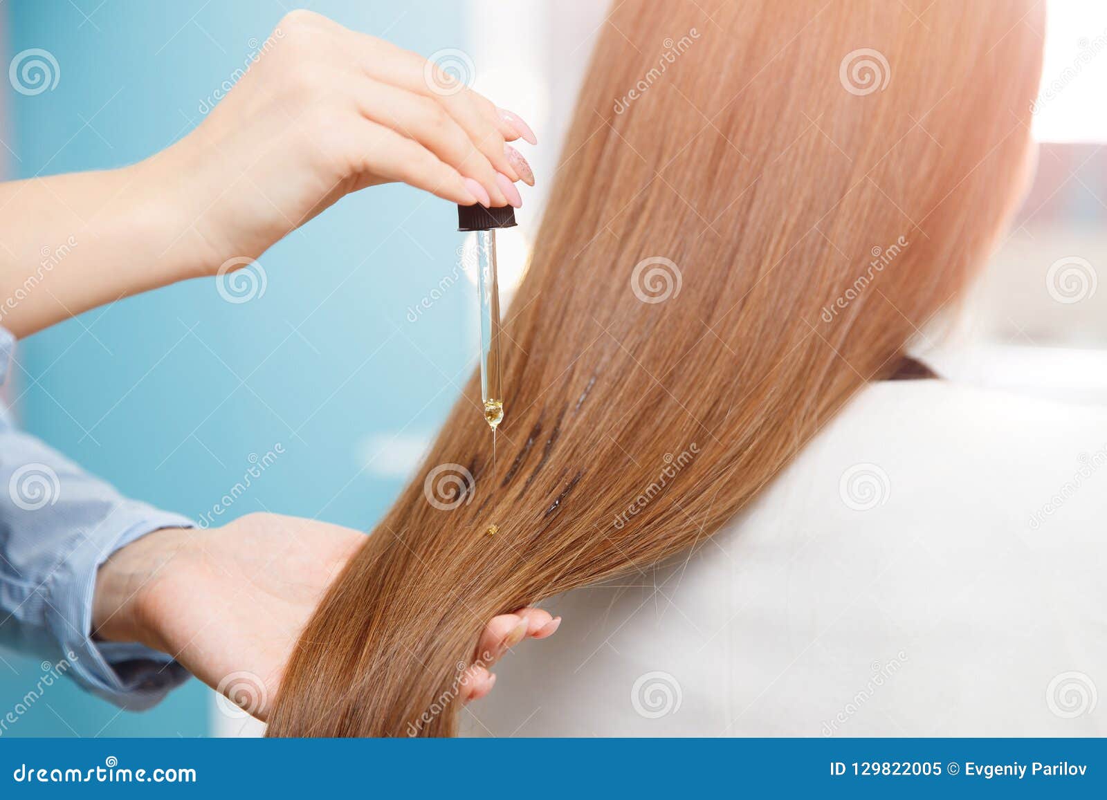 Master Hairdresser Applies Oil To Hair Care For And Restore Growth Of